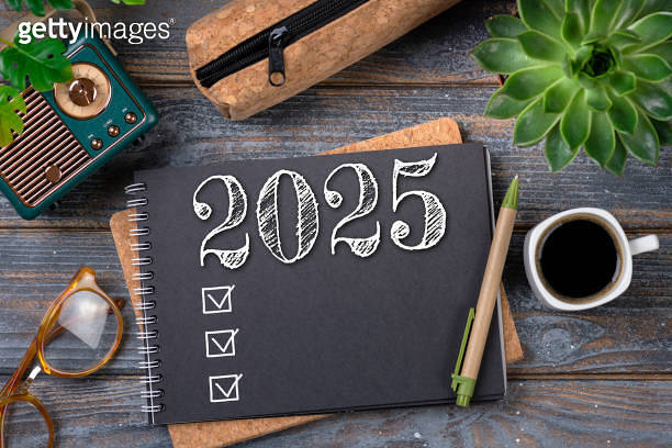 New year resolutions 2025 on desk. 2025 goals list with notebook ...