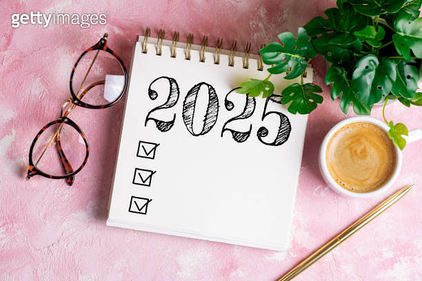 New year resolutions 2025 on desk. 2025 goals list with notebook ...