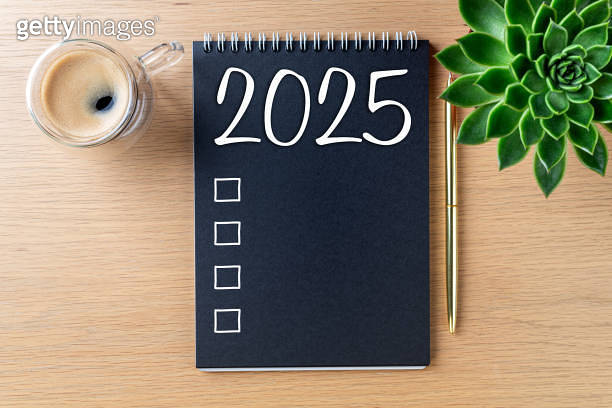 New year resolutions 2025 on desk. 2025 goals list with notebook ...