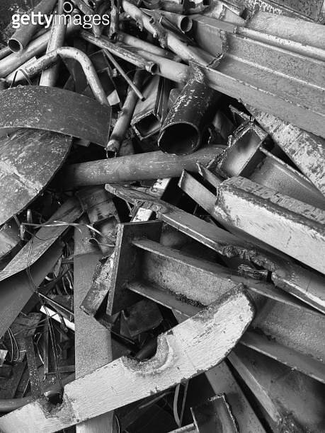 Old and rust steel waste,used metal, piled together in rubbish room ...