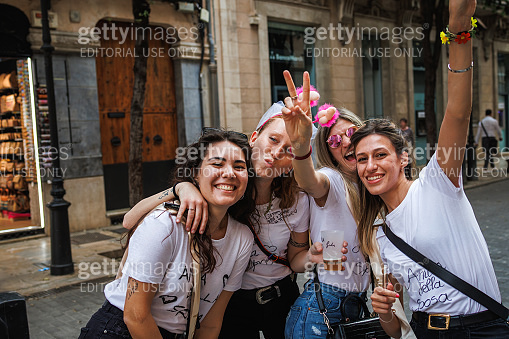 Cheerful and happy young women and girls bring joy to the streets of ...