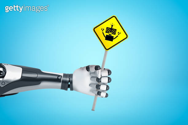 Robotic hand holding yellow robot road sign on blue background 이미지 ...