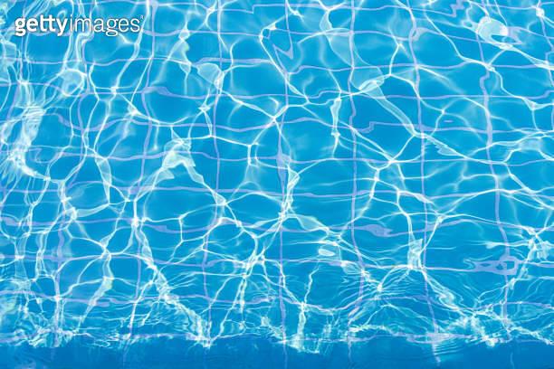 Blue swimming pool water surface and ripple wave background. Summer ...