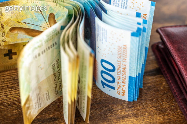 Switzerland money, Stack of unfolded cash next to wallet, Swiss francs ...