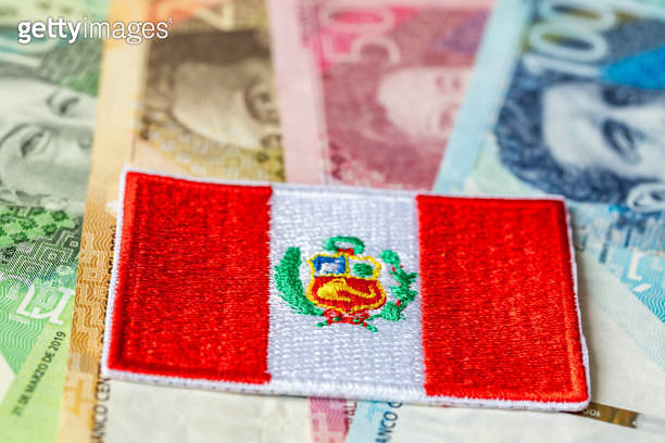 Peru money, Peruvian banknotes lying on the table together with the ...