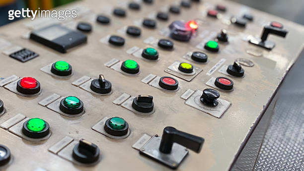 Machine control buttons in industrial factories, many buttons, controls ...