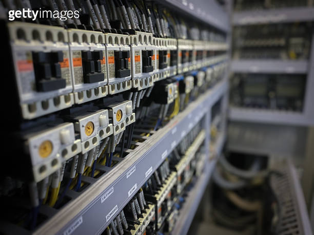 Switch breakers in large electrical control cabinets in industrial ...