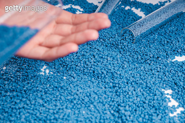 White plastic grain, plastic polymer granules,hand hold Polymer pellets ...