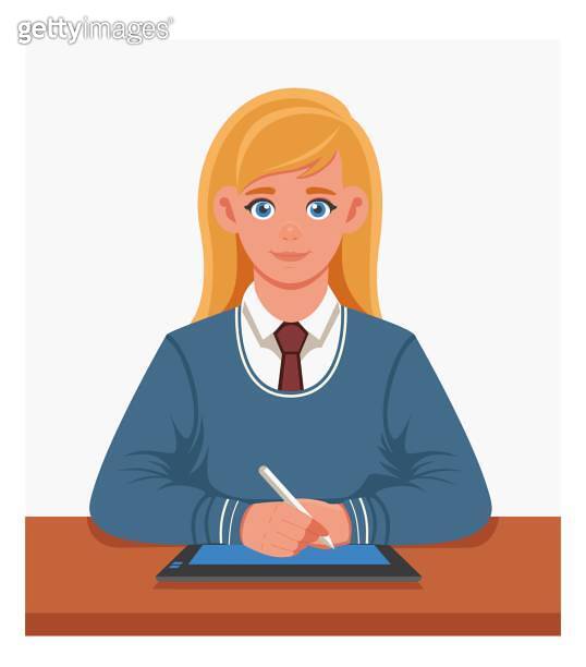 Student sitting at a desk studying to be a graphic designer using a ...