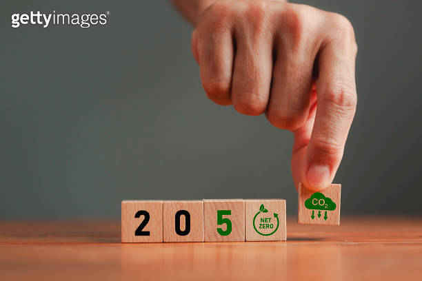 Net zero emissions concept with Hand puts wooden cubes with CO2 ...