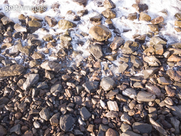Rocky beach with Atlantic Ocean waves meeting with underwater sharp ...