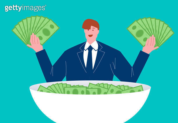 Happy businessman taking out bills from inside a bowl full of bills to ...