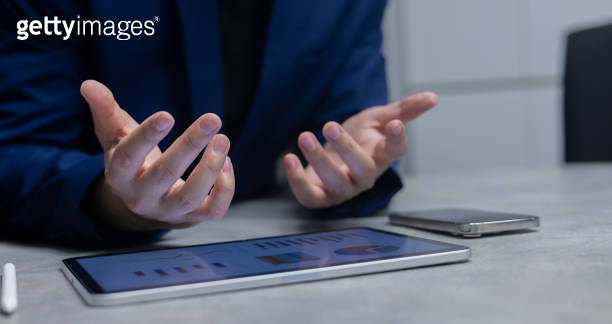 close up businessman hand gesture to explain about summary chart ...