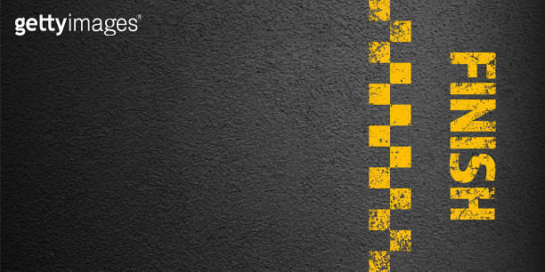 Asphalt road with yellow finish line marking, concrete highway surface ...