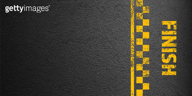 Asphalt road with yellow finish line marking, concrete highway surface ...