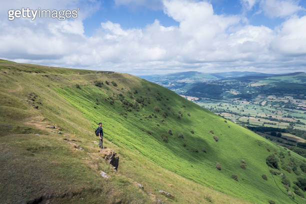Hiker Backpacker on the mountain of Abergavenny, wales, England, summer ...