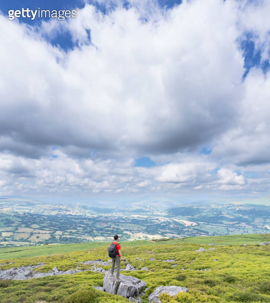 Hiker Backpacker on the mountain of Abergavenny, wales, England, summer ...
