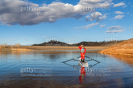 Senior male rower in a coastal rowing shell, Literace 1x by Liteboat ...
