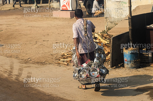 Bangladeshi man selling kitchen utensils on the street in Chittagong ...