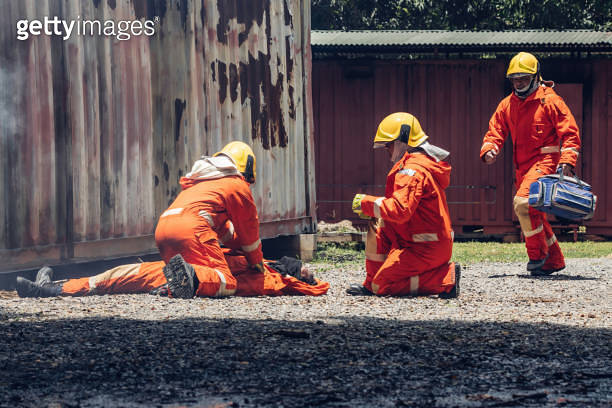 First aid support accident at work. Firefighter to save girl in fire ...