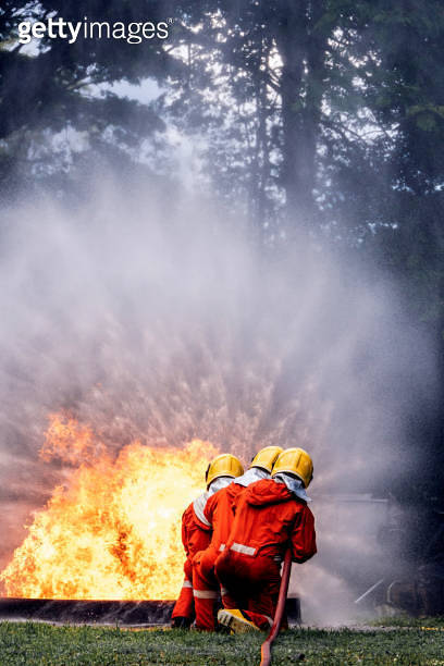 Firefighter Concept. Several firefighters go offensive for a fire ...