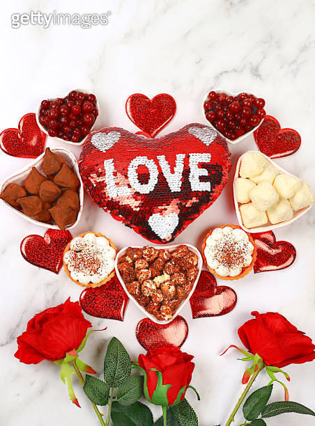 Delicious heart shaped chocolate candies, sugar cranberry, meringue and ...