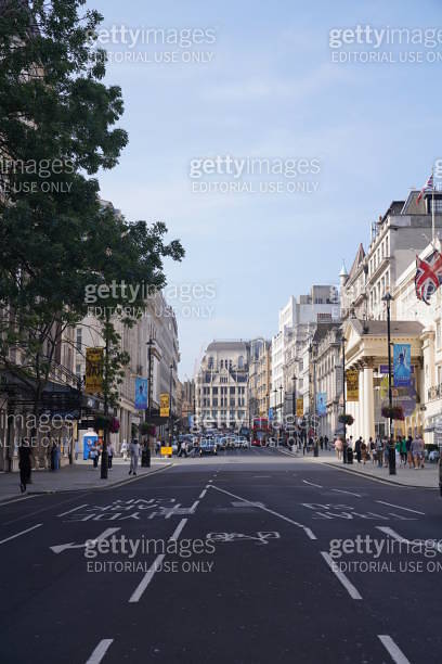 Haymarket main street, London SW1, from Pall Mall East on a summer day ...