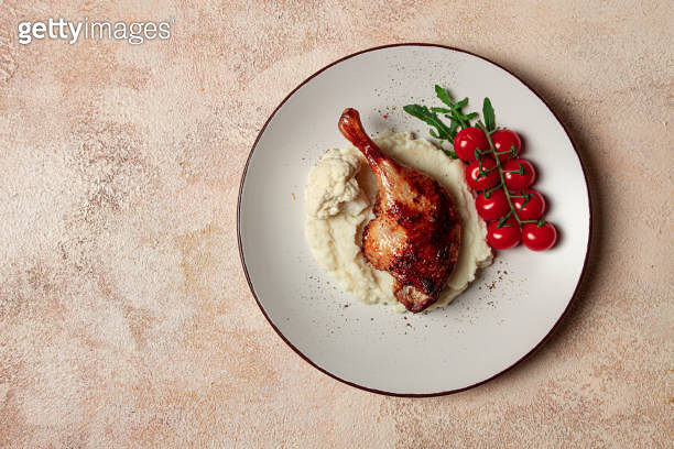Fried duck shank, cauliflower puree, cherry tomatoes, homemade, no ...