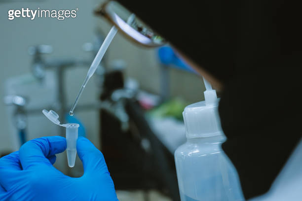 Precise Work: Muslim Female Scientist Carefully Loading Liquid Sample ...