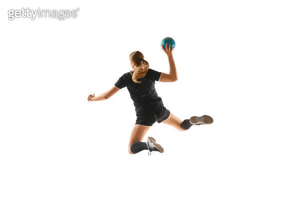 Active female handball player demonstrating throwing techniques ...