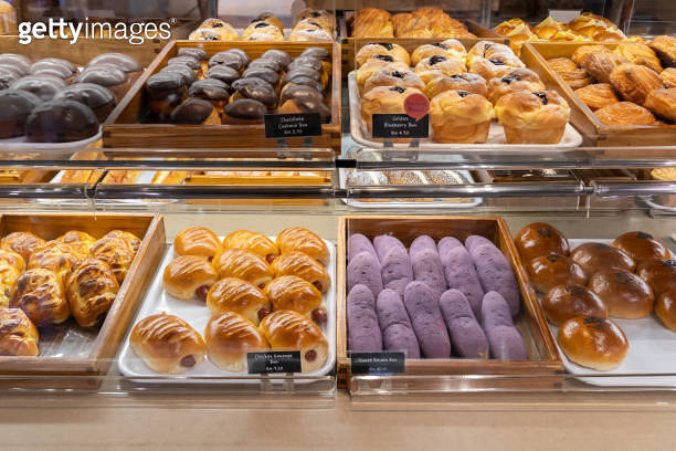 Assorted pastry and bread arranged on tray selling at bakery shop. 이미지 ...