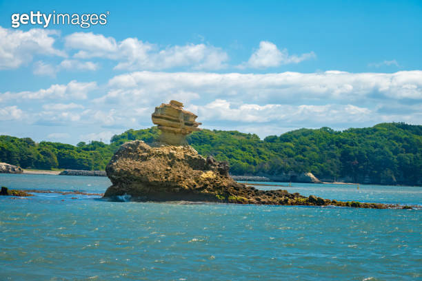 Head shaped rock formation off the lush coast of Japan, Matsushima bay ...