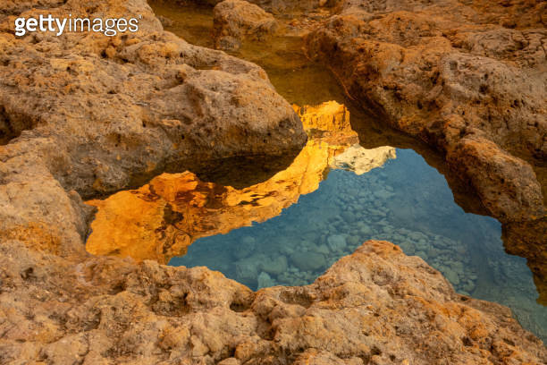 Tidal pool at the base of the stunning Algar seco cliffs, Carvoeiro ...