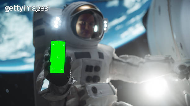 Young Astronaut Floating in Space in Zero Gravity. Spaceman Showing a ...