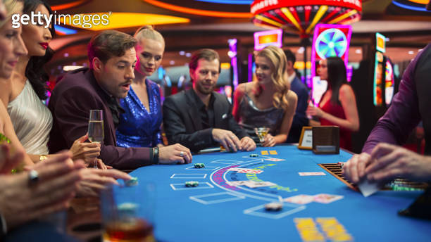 Group of Casino Goers Enjoying Time in a Modern Casino, Friends Placing ...