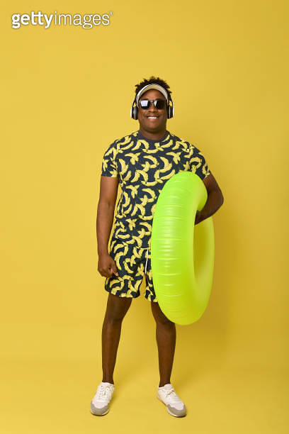 Stylish man in suit with pattern bananas posing camera with attributes ...