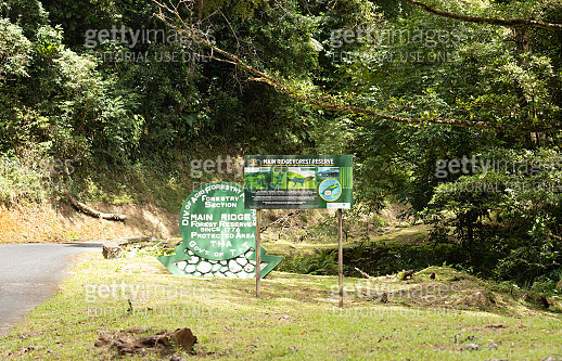 Signs at an entrance to the Main Ridge Forest Reserve in Tobago. 이미지 ...