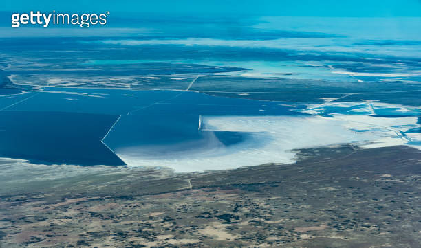 Solar salt pans at Laguna Ojo de Liebre on the Pacific Ocean side of ...