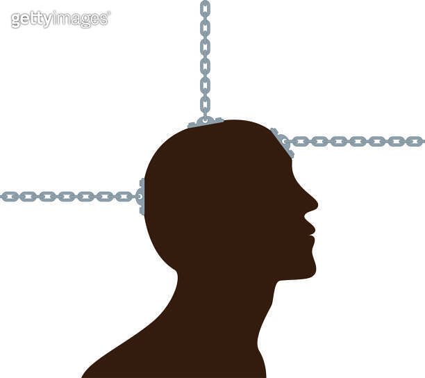 Chained human head, concept of narrow thinking, prison or slavery ...