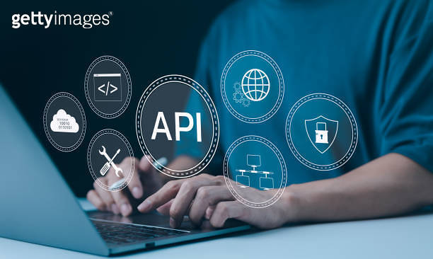 API Application Programming Interface Concept. A programmer types on a ...