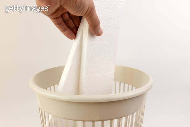 Pieces of Styrofoam are thrown into the trash can. Disposal of ...