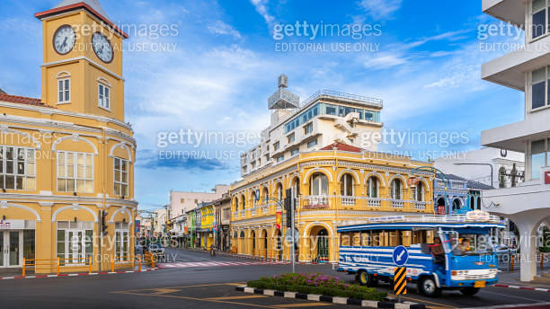 The iconic yellow clock tower and historic Chartered Bank building in ...