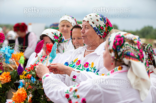 A holiday of ethnic cultures.Men and women in national Belarusian ...