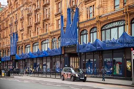 Harrods department store in Knightsbridge covered in blue cloth for ...