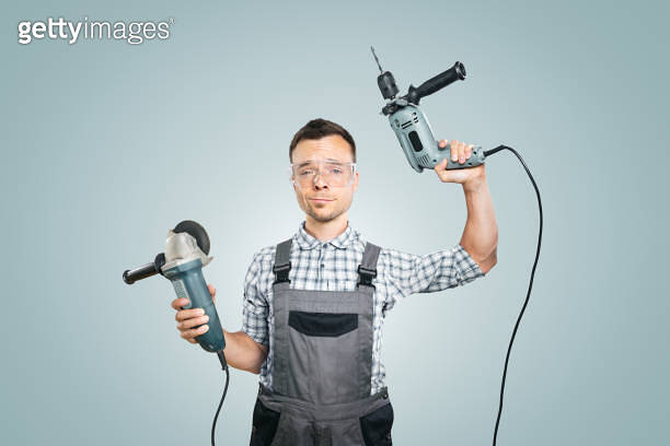 Portrait of a Handyman Holding Power Tools in Both Hands (2176079286 ...