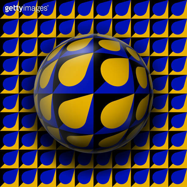 Sphere on surface with blue and golden drops pattern seems to be moving ...