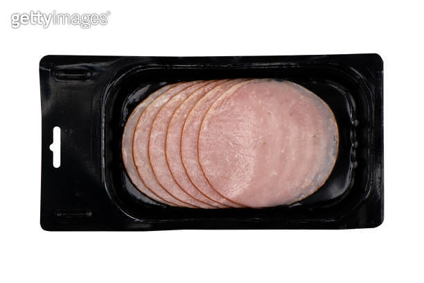 Sliced smoked beef meat in vacuum package isolated on white background ...