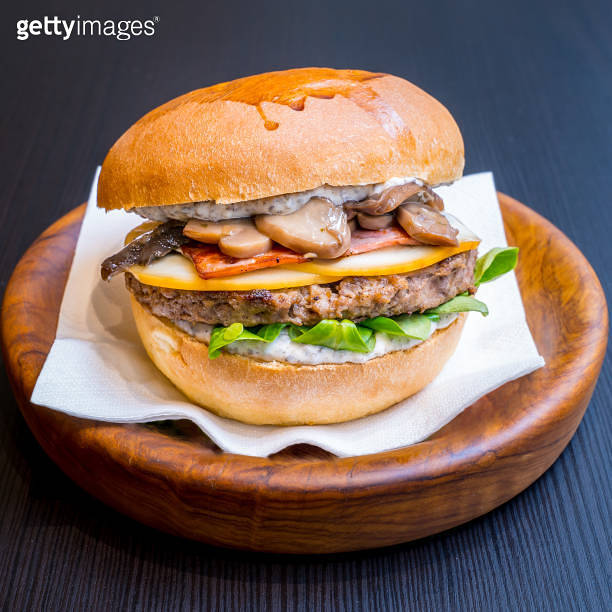 A delicious and tasty Hamburger with grilled beef burger, Provolone ...