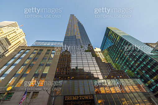 A beautiful view of the Trump Tower skyscraper with the reflection of ...