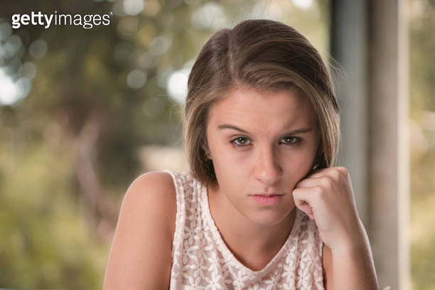 Hispanic young woman with angry and pissed off facial expression and ...